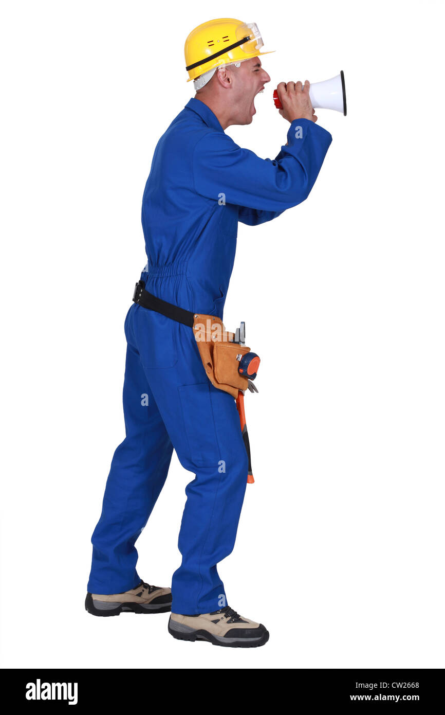 Builder yelling into megaphone Stock Photo - Alamy