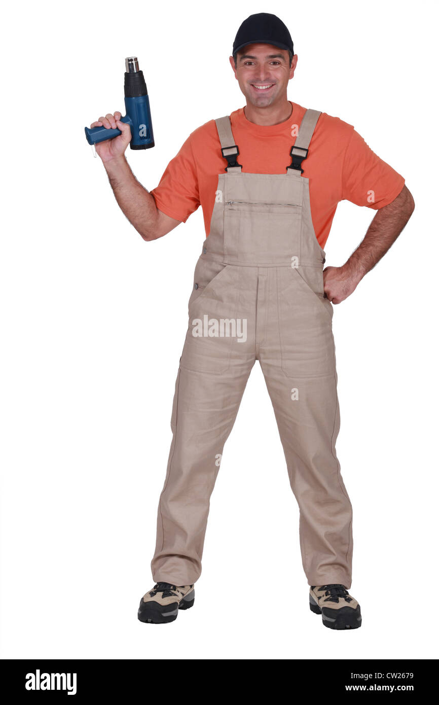 Man holding heat-gun Stock Photo - Alamy