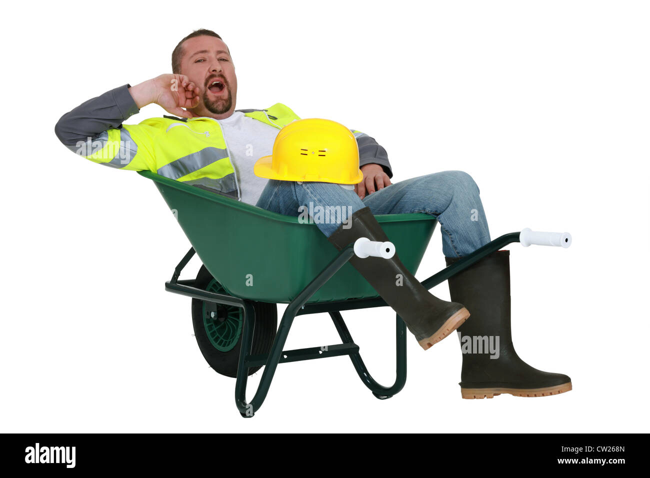 Man snoozing in wheelbarrow Stock Photo - Alamy
