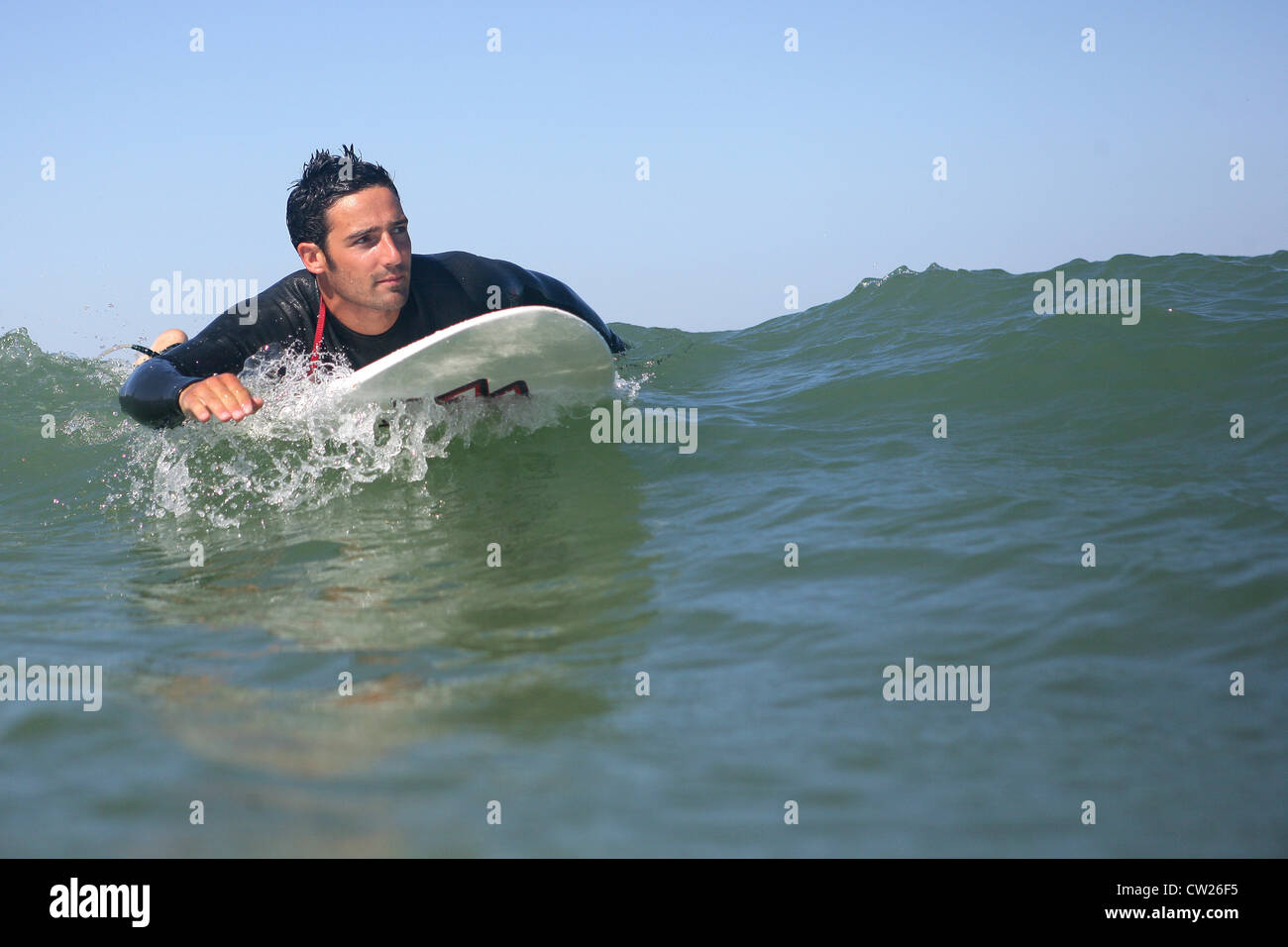 Surfer on a wave Stock Photo - Alamy
