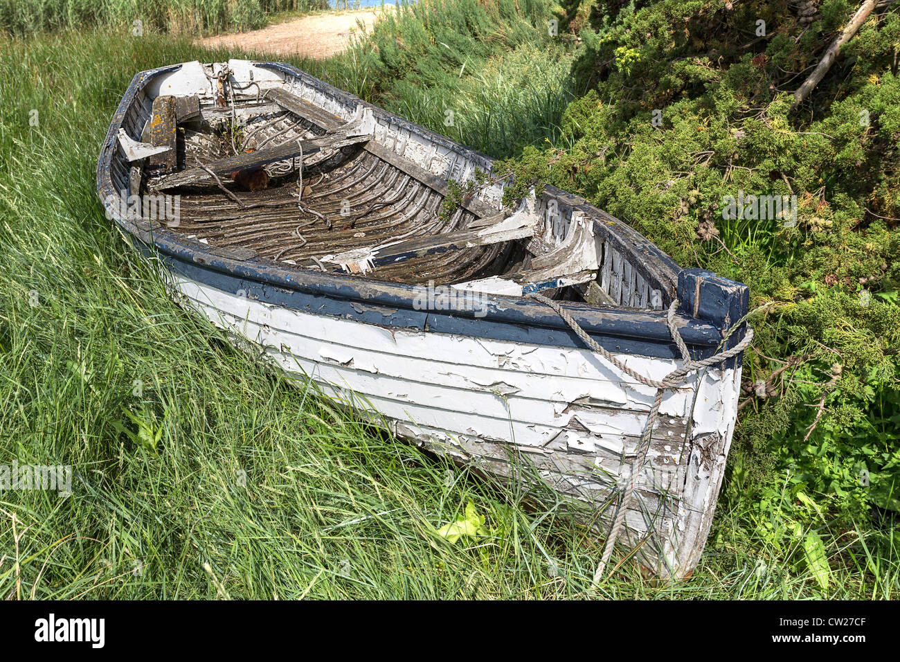 The skeleton of an old dilapidated and decaying boat left to rot on a ...