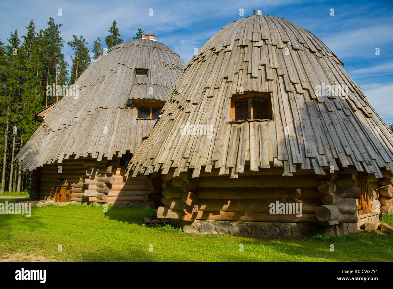 Two interesting architecture houses maded from round wood Stock Photo ...