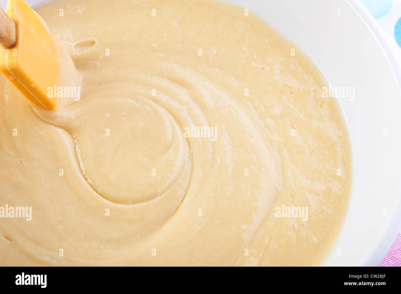 Preparing to bake a cake, stirring the batter Stock Photo - Alamy