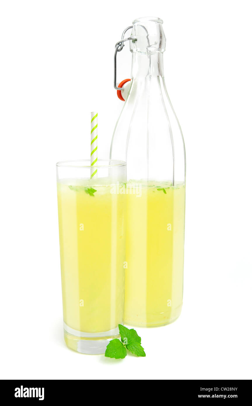 Glass of lemonade with straw and bottle Stock Photo - Alamy