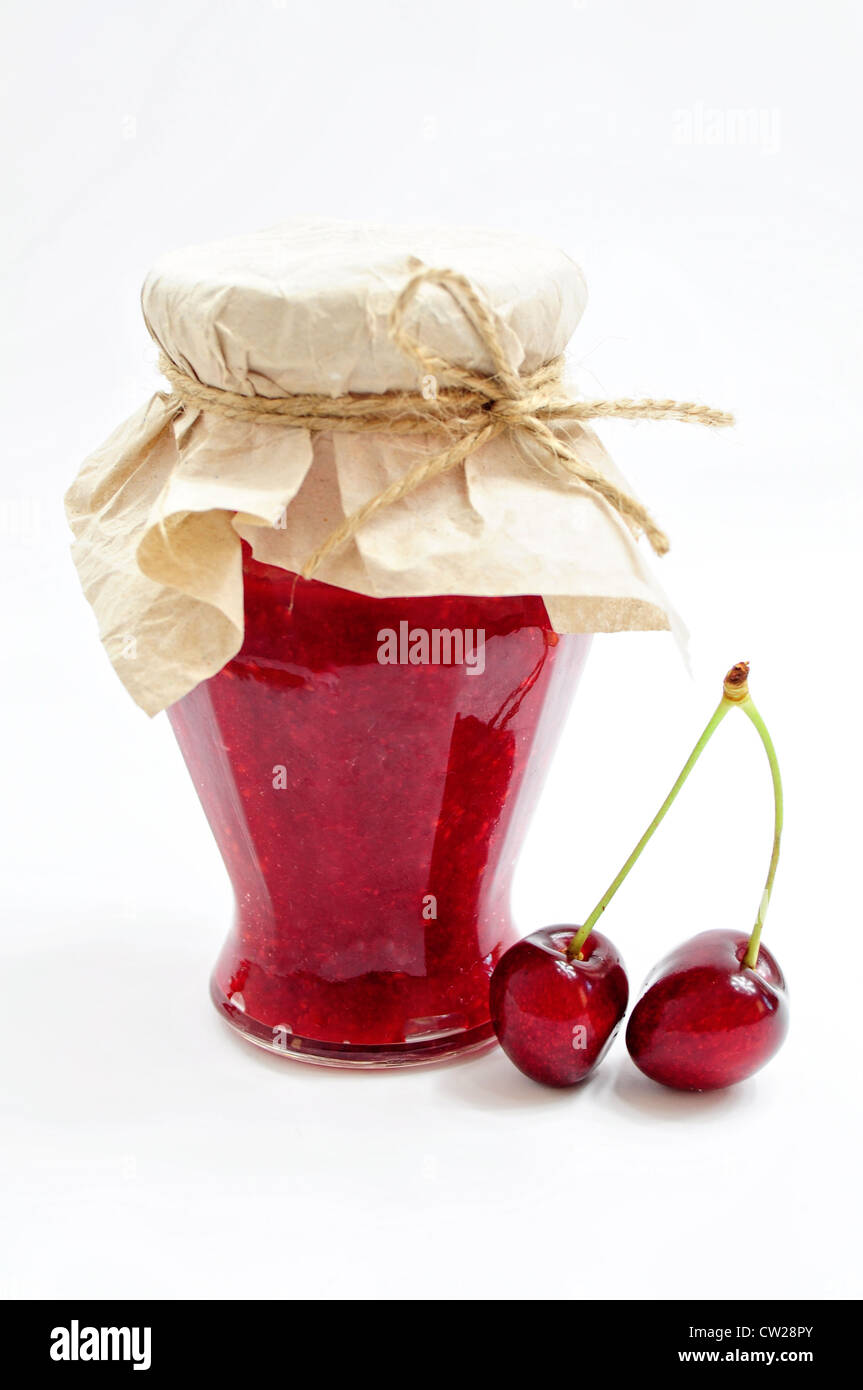 Jar of homemade cherry jam and couple of cherries Stock Photo - Alamy