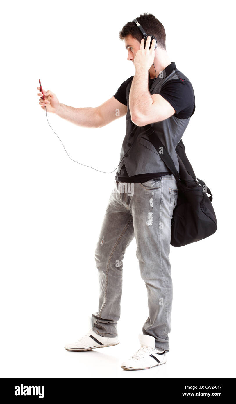 Full length portrait school boy with phone isolated on white. Music or ...