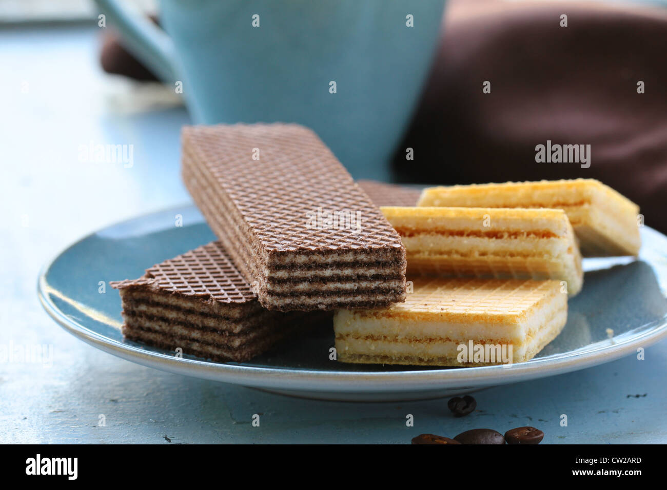 chocolate and vanilla wafers on the blue plate Stock Photo - Alamy