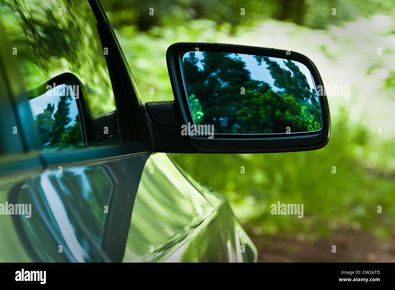 Landscape in the sideview mirror of a speeding car Stock Photo - Alamy