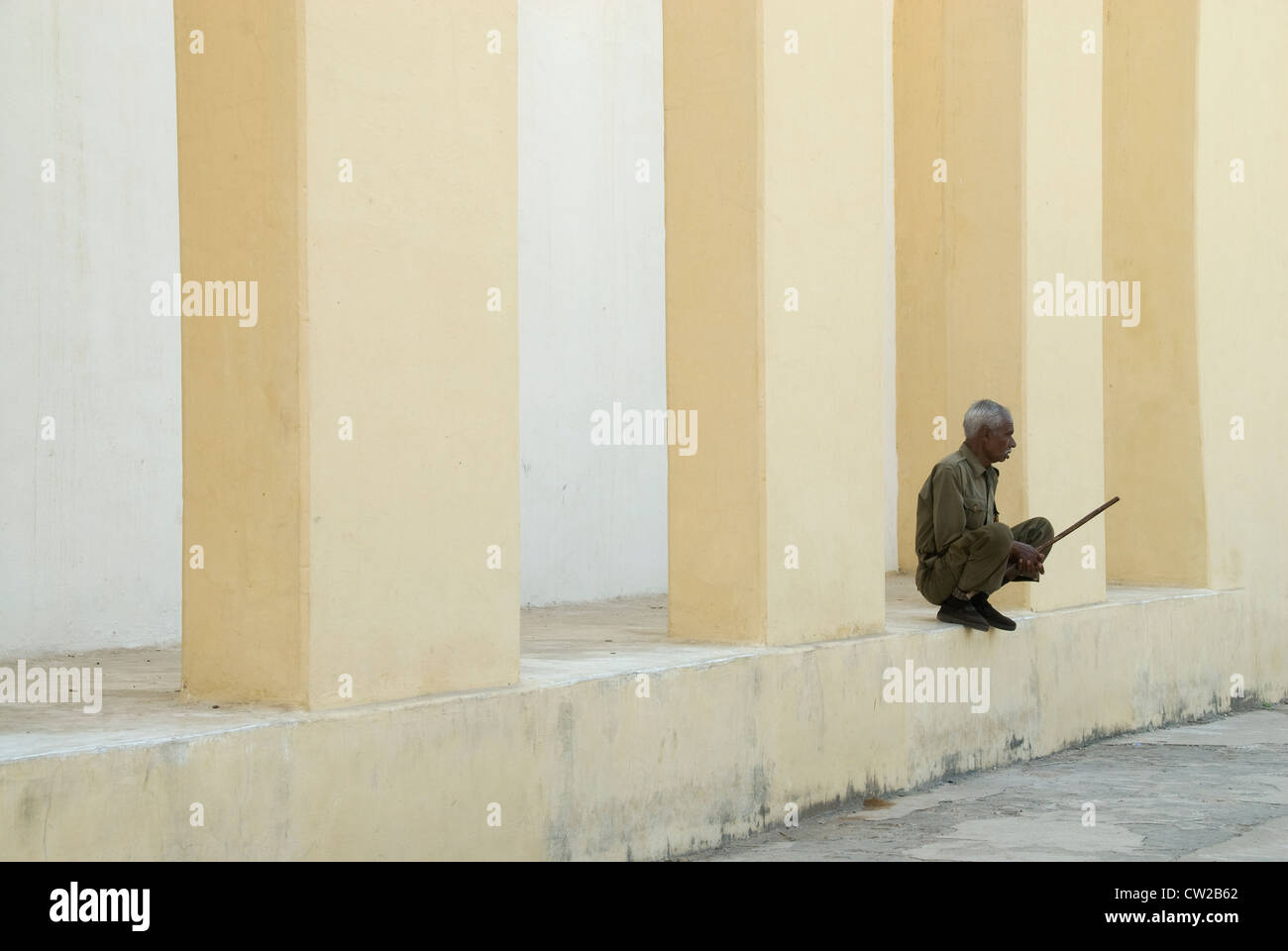 Indian Security Guard sitting alone - Bamboo Cane in his hand - Jantar ...