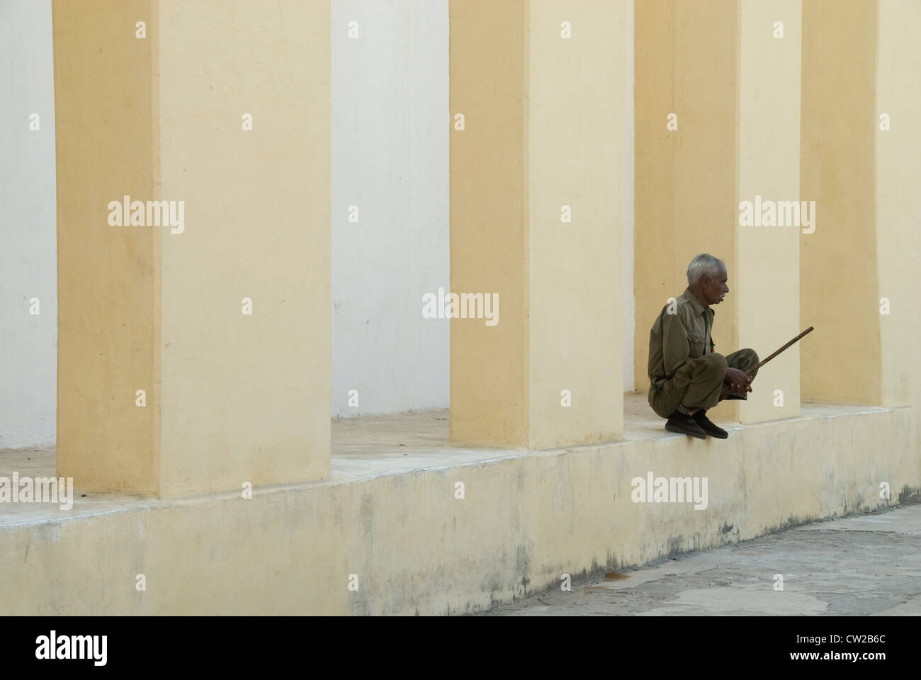 Indian Security Guard sitting alone - Bamboo Cane in his hand - Jantar ...