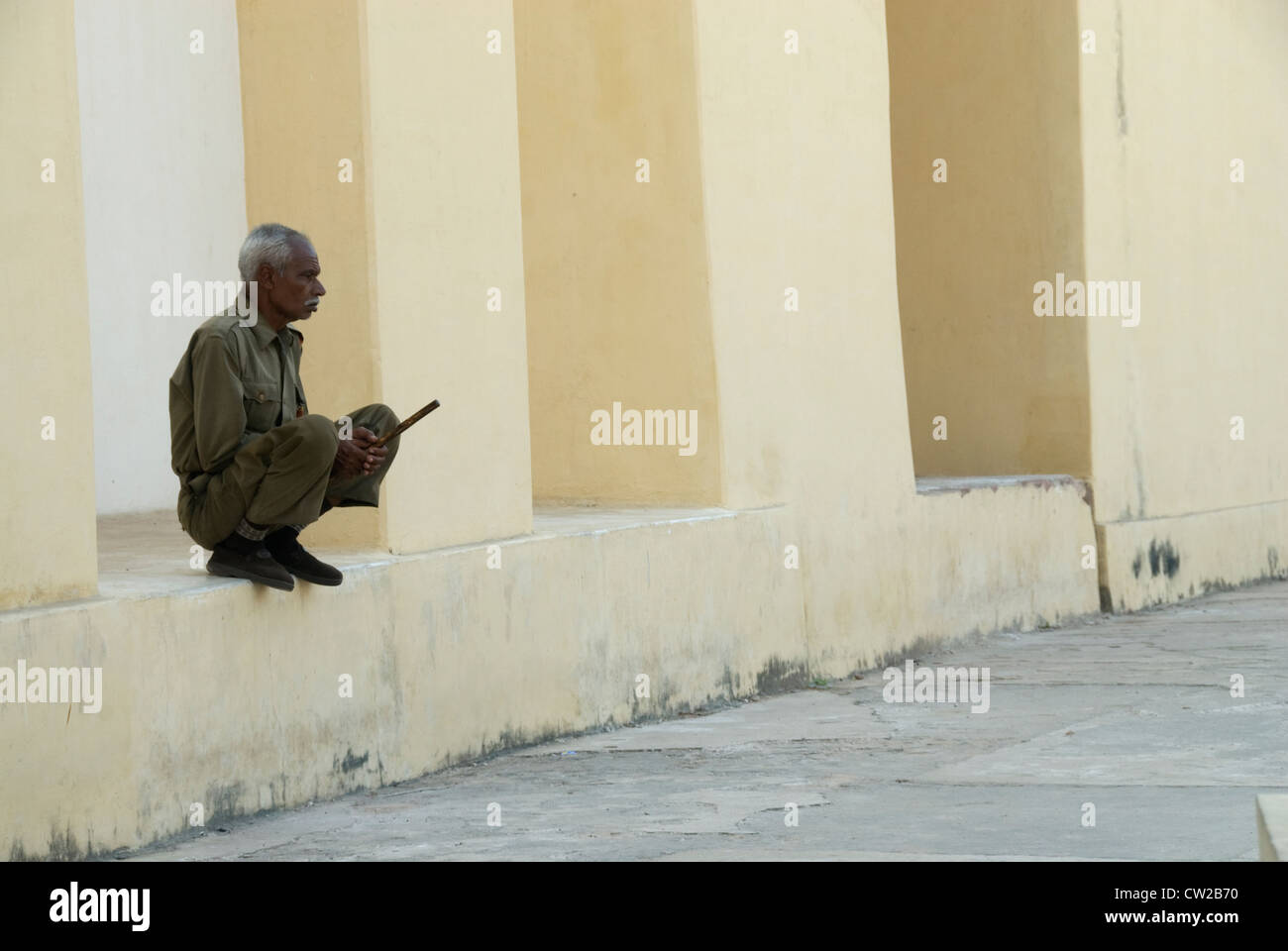 Indian Security Guard sitting alone - Bamboo Cane in his hand - Jantar ...