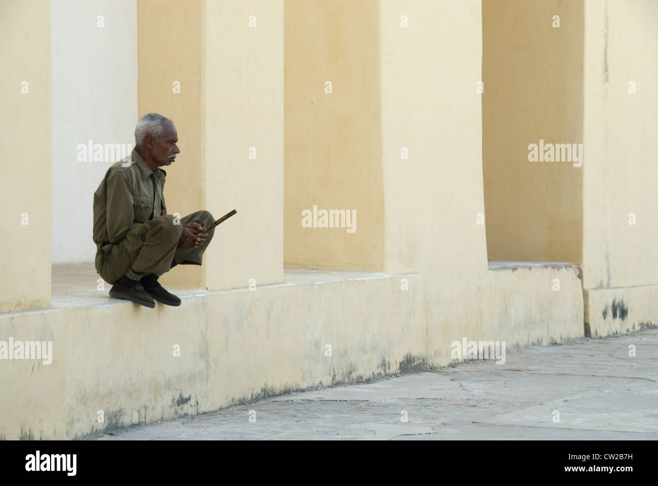Indian Security Guard sitting alone - Bamboo Cane in his hand - Jantar ...
