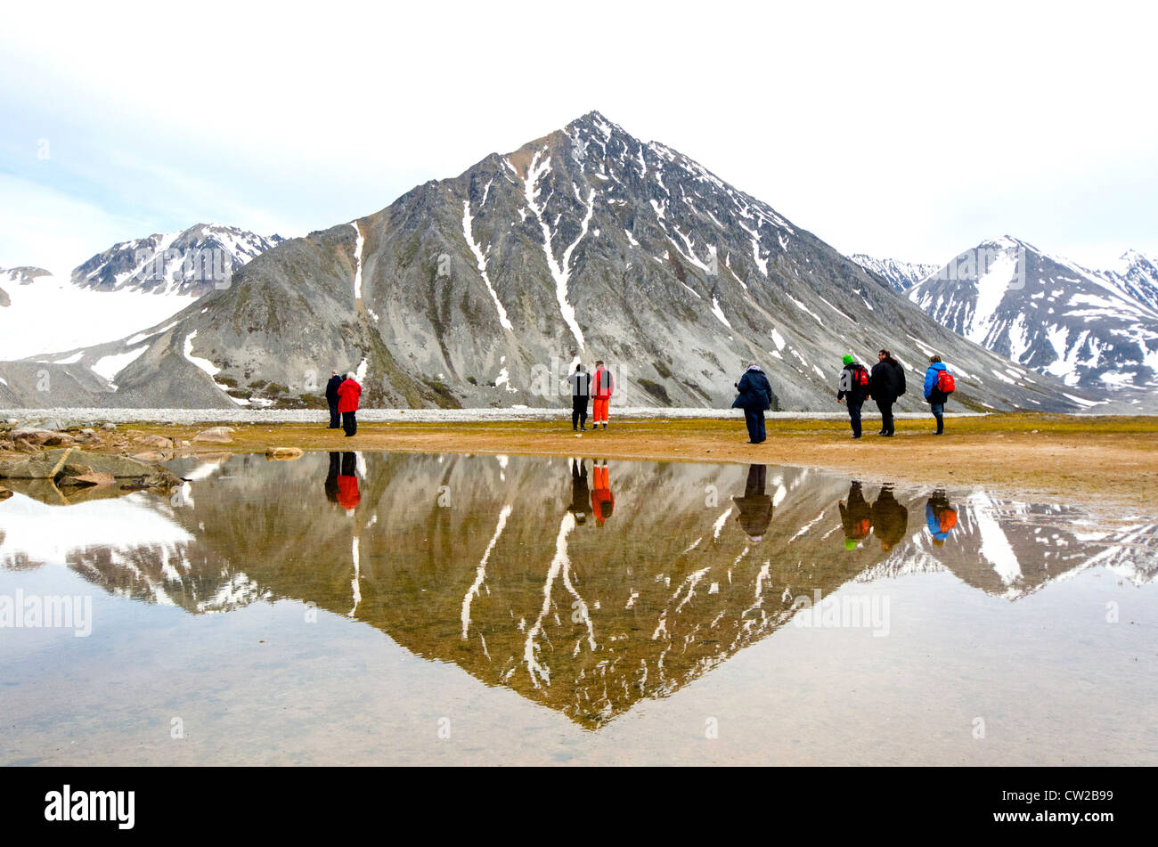 People hiking Magdalene Fjord Spitsbergen Svalbard Norway Scandinavia ...
