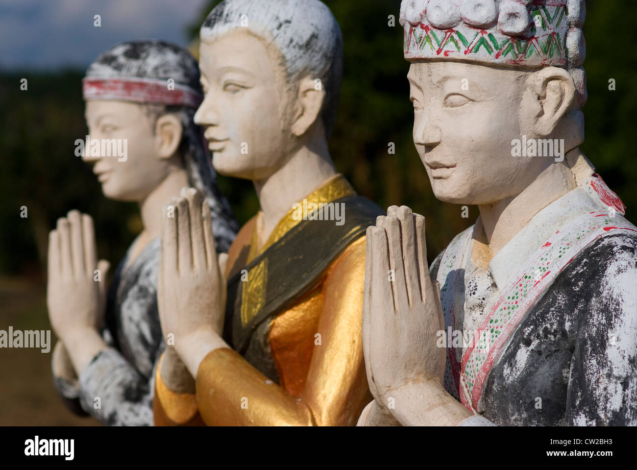 three statues in a temple, luang namtha, laos Stock Photo - Alamy