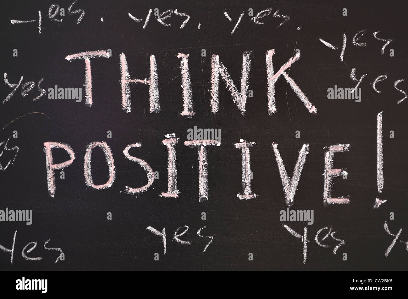 think positive concept handwritten on black chalkboard Stock Photo - Alamy