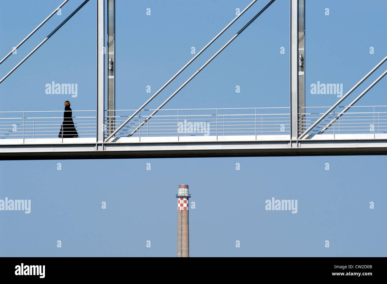 Woman goes over a bridge Stock Photo - Alamy