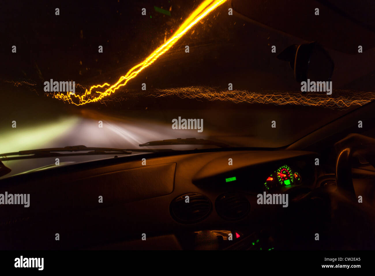 Light trails seen through a car window at night Stock Photo - Alamy