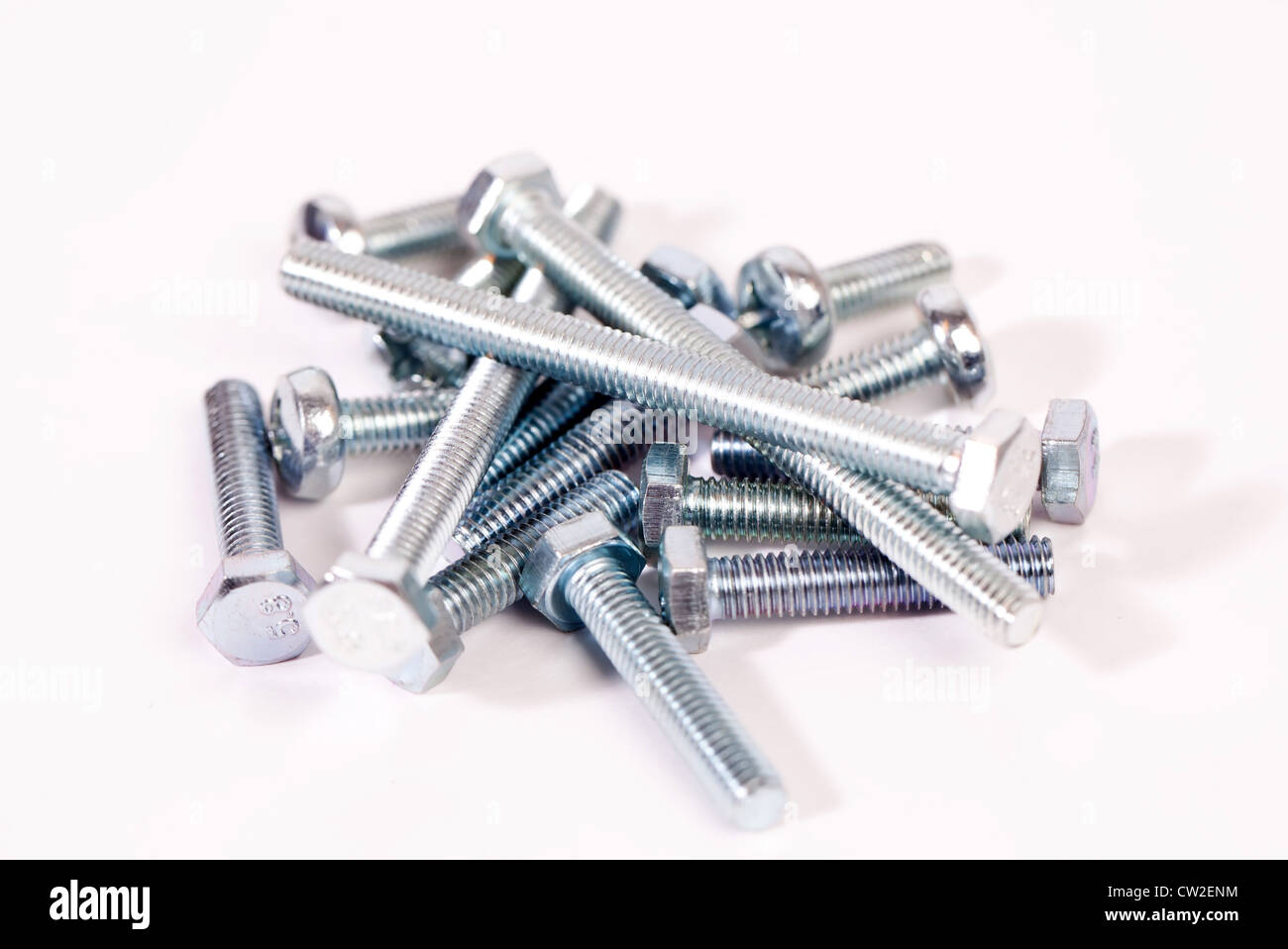 Metal bolts on white background Stock Photo - Alamy