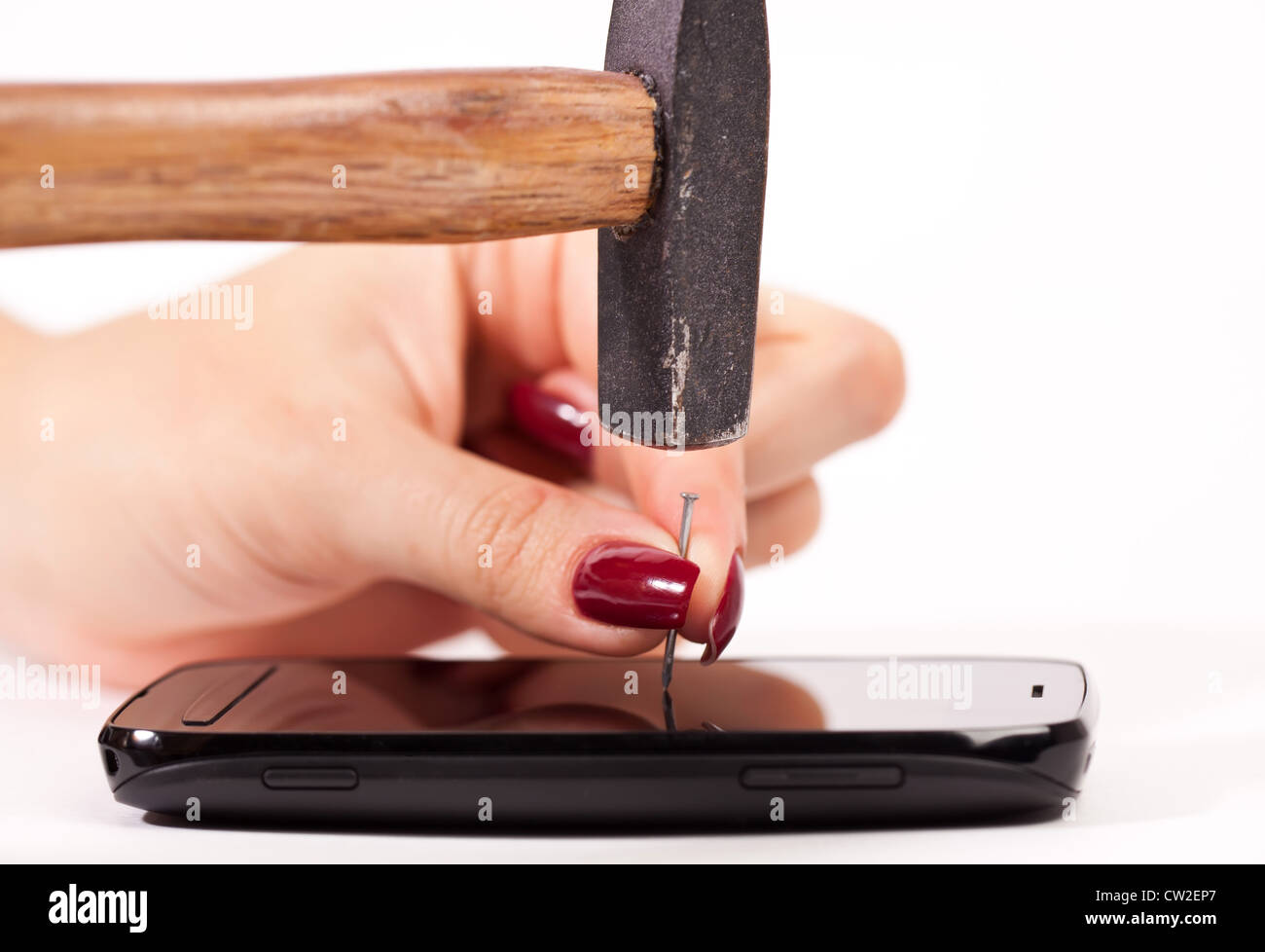 Hammer and phone on white background in attempt to brake monitor Stock ...