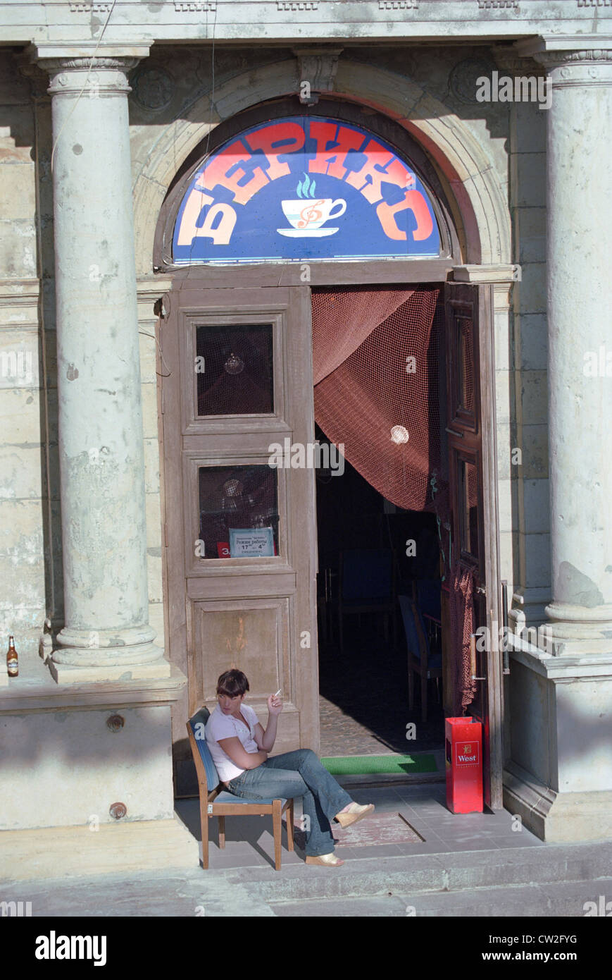 Woman in front of an entrance to a bar in Kaliningrad, Russia Stock ...