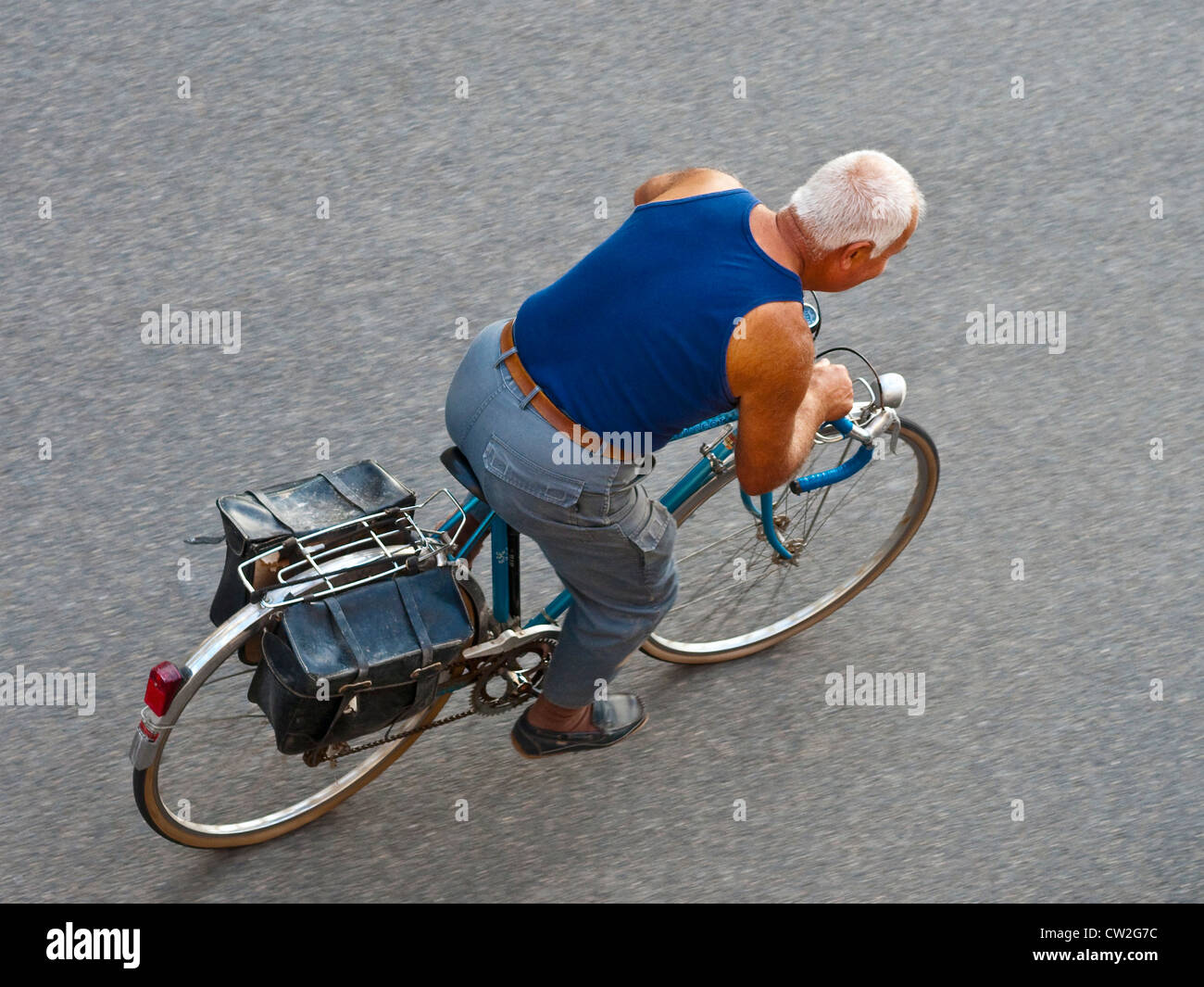 Overhead view of man cycling to work - France Stock Photo - Alamy