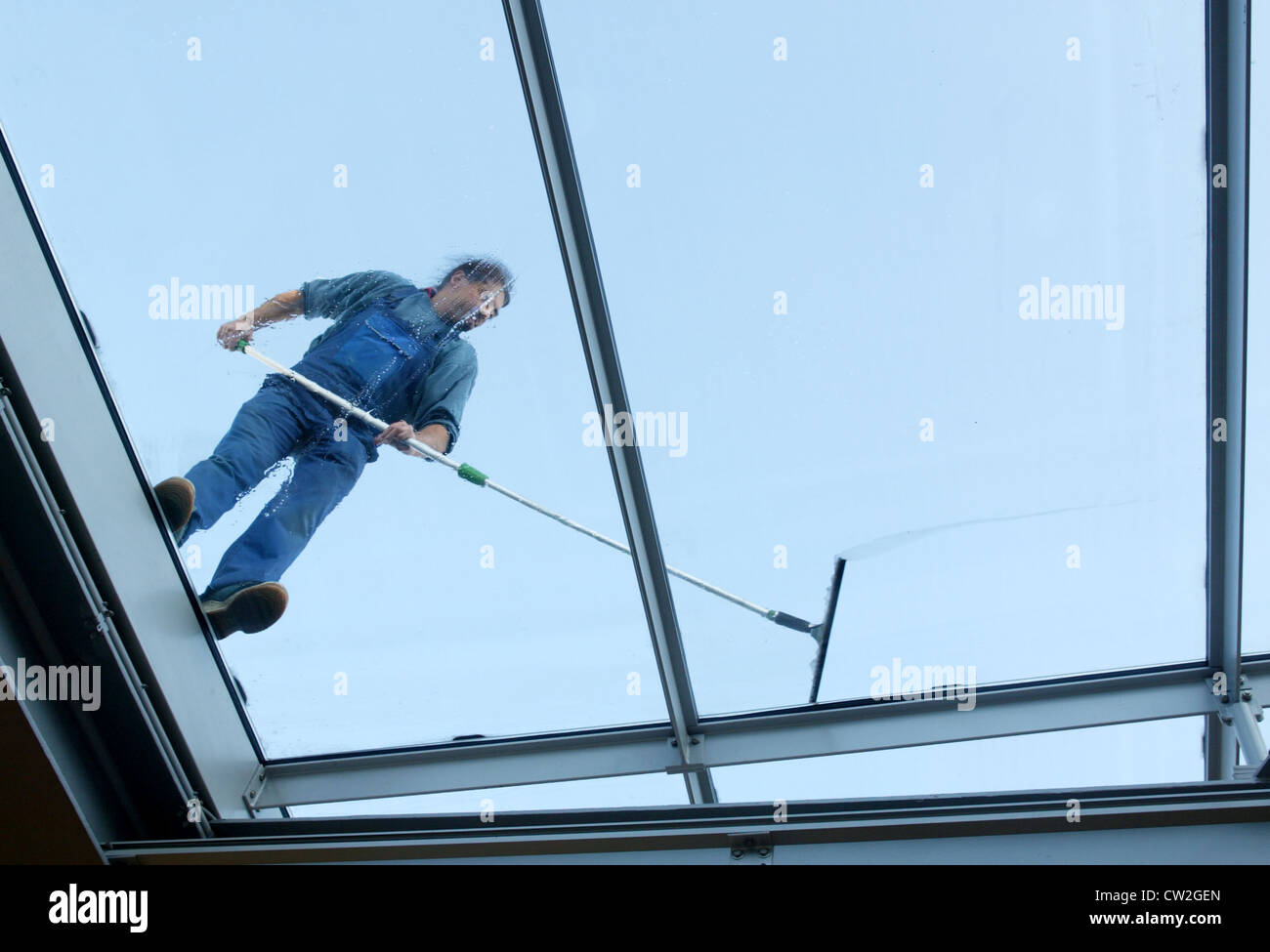 A window washer cleans the glass roof, Duisburg Stock Photo - Alamy