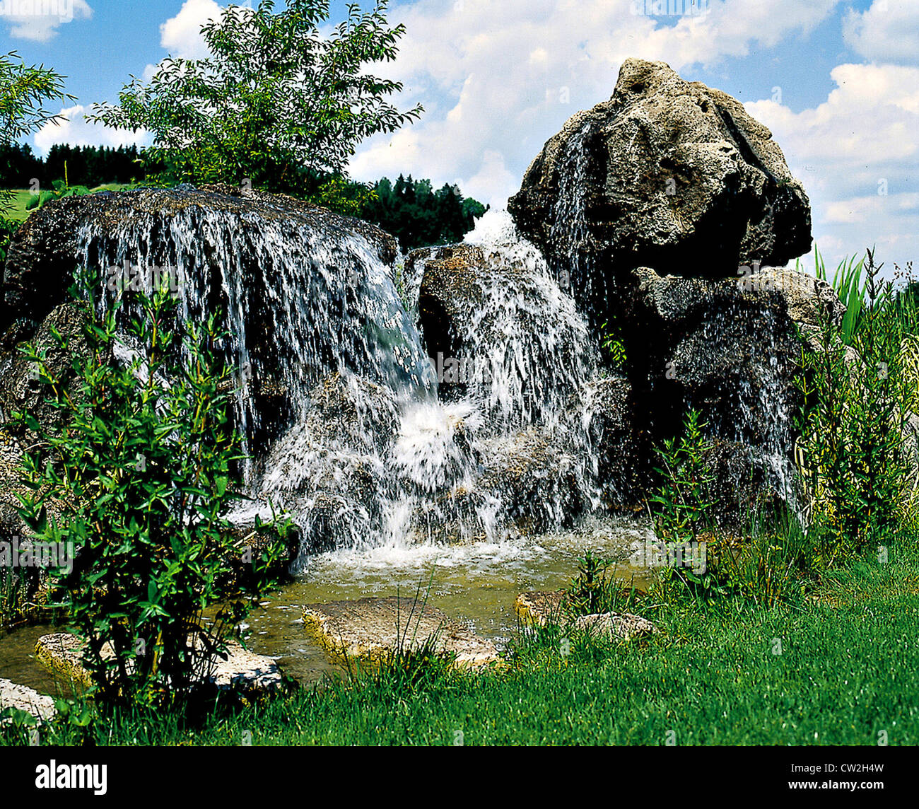 Waterfall in a park Stock Photo - Alamy