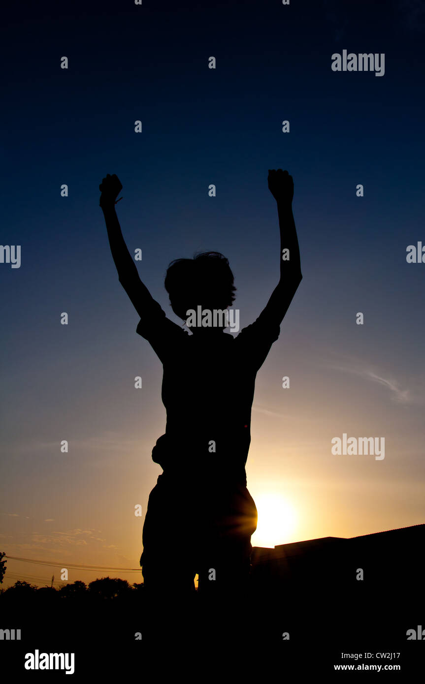 silhouette of man jumping for victory Stock Photo - Alamy