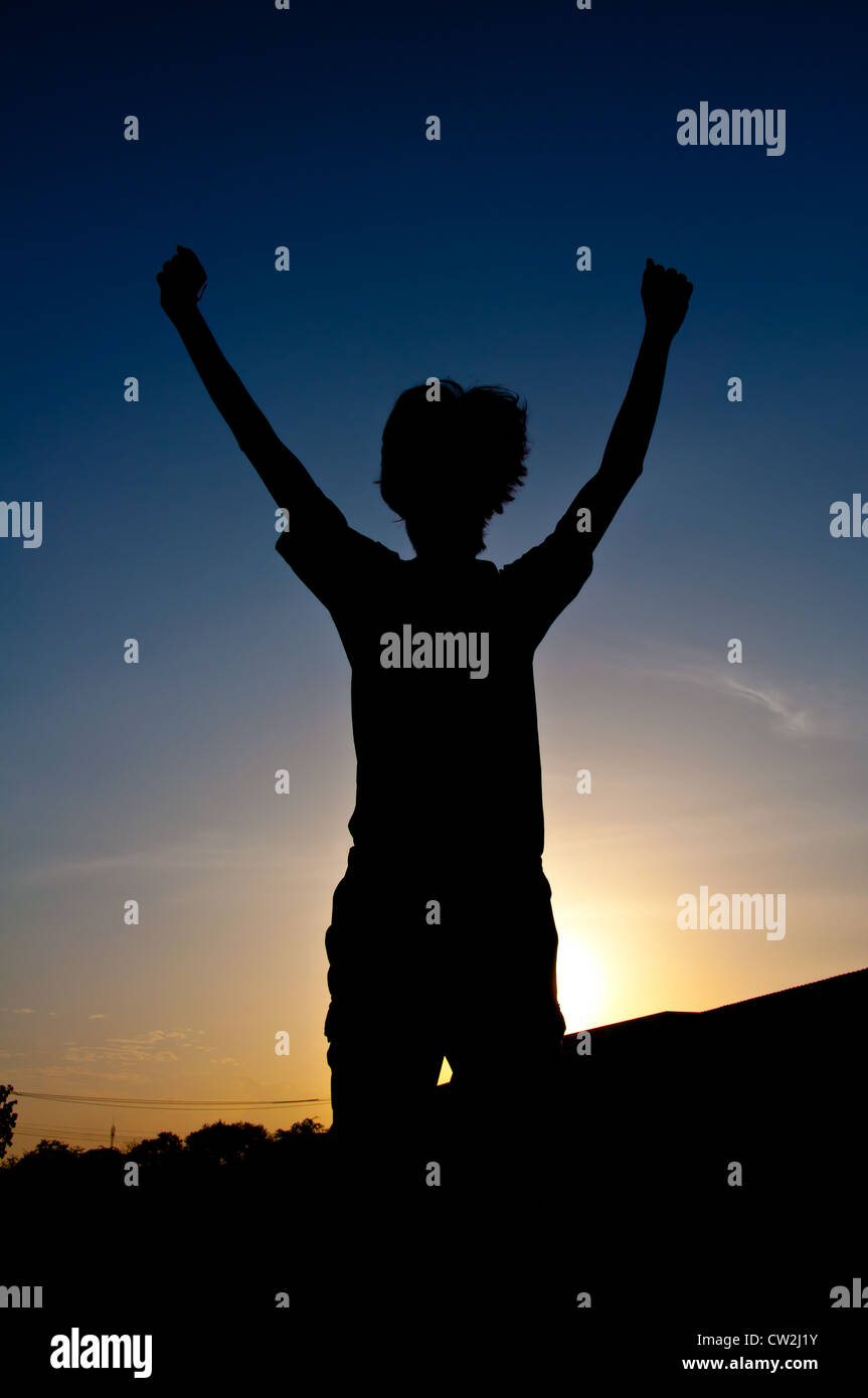 silhouette of man jumping for victory Stock Photo - Alamy