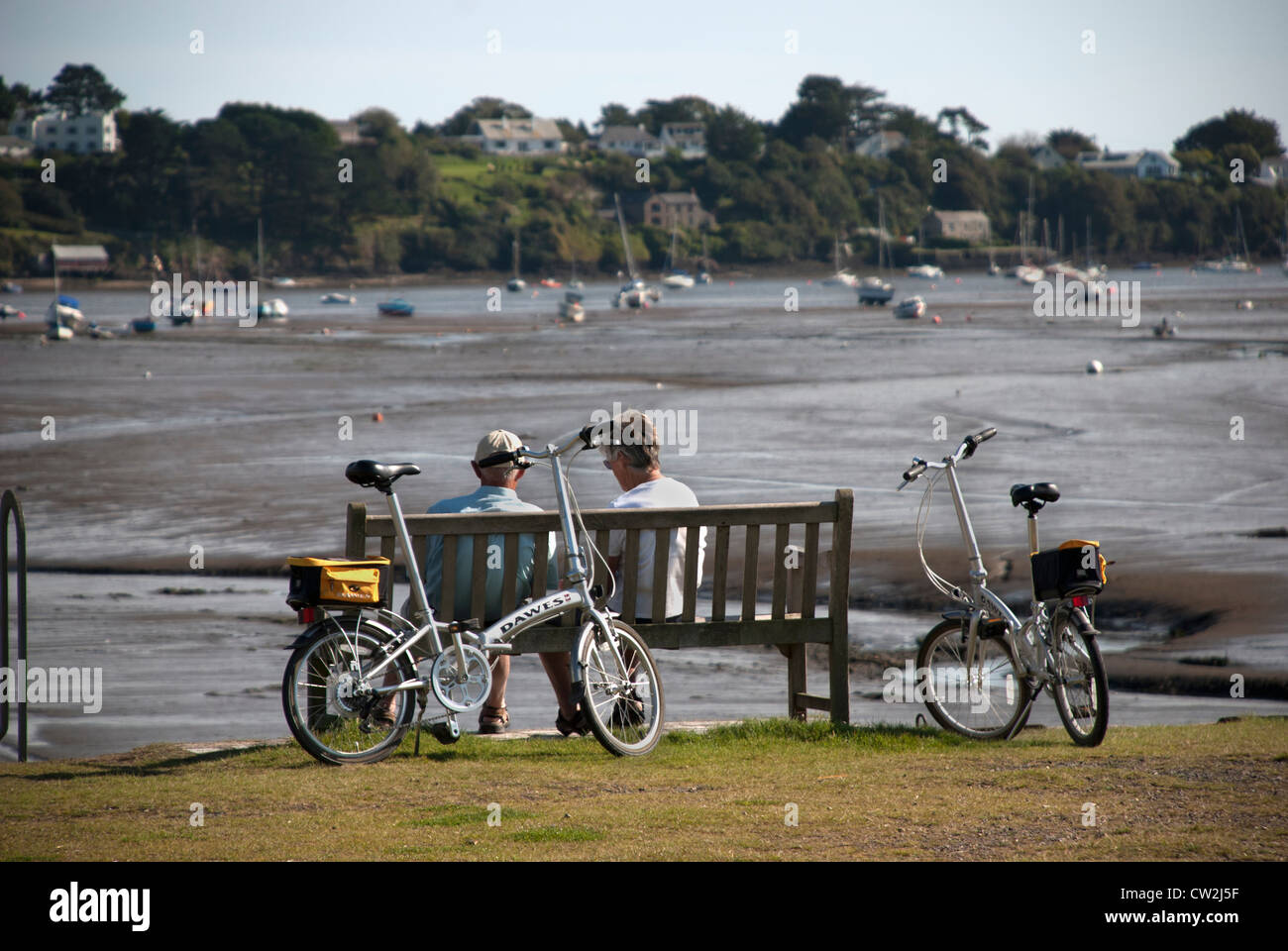 Two senior citizens relax during a bike ride and plan their route Stock ...