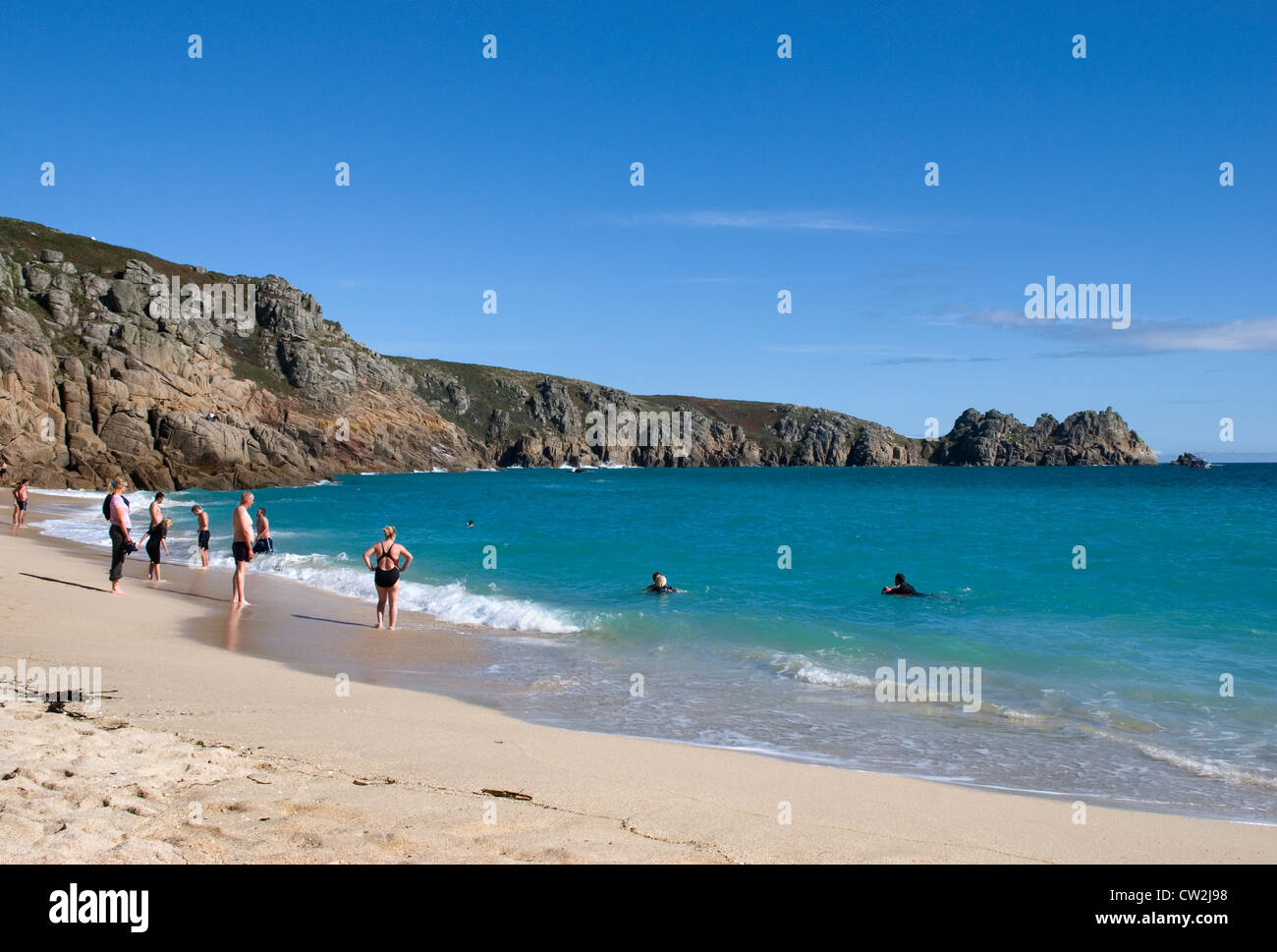 Families enjoying the beach at Porthcurno Cornwall Stock Photo - Alamy