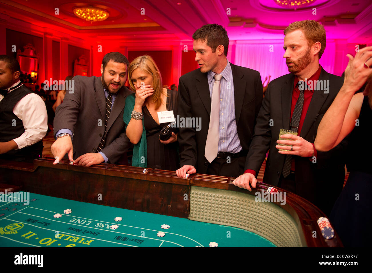 Young people gambling at a casino Stock Photo - Alamy