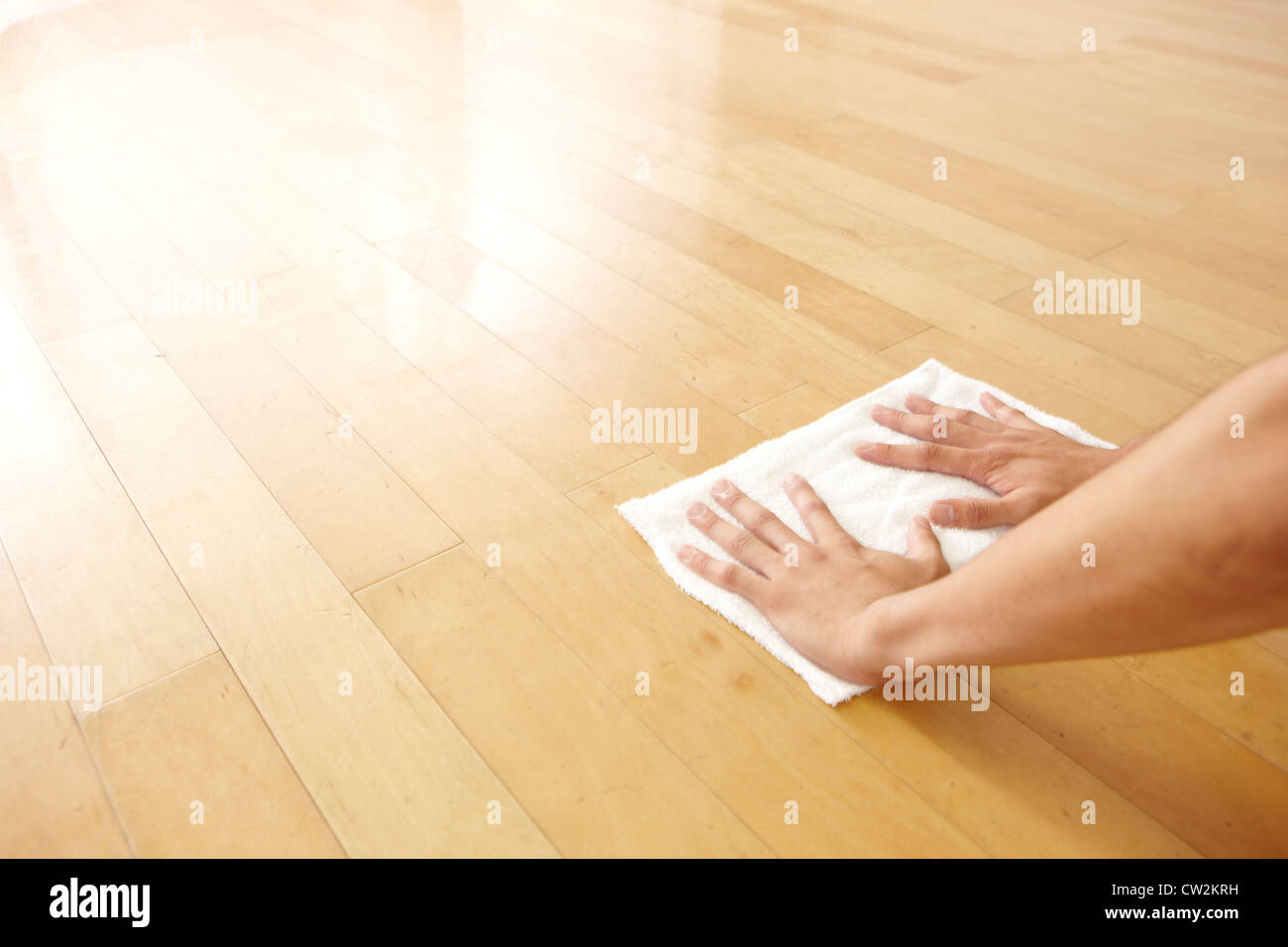 Woman cleaning hardwood floor with a rag Stock Photo - Alamy