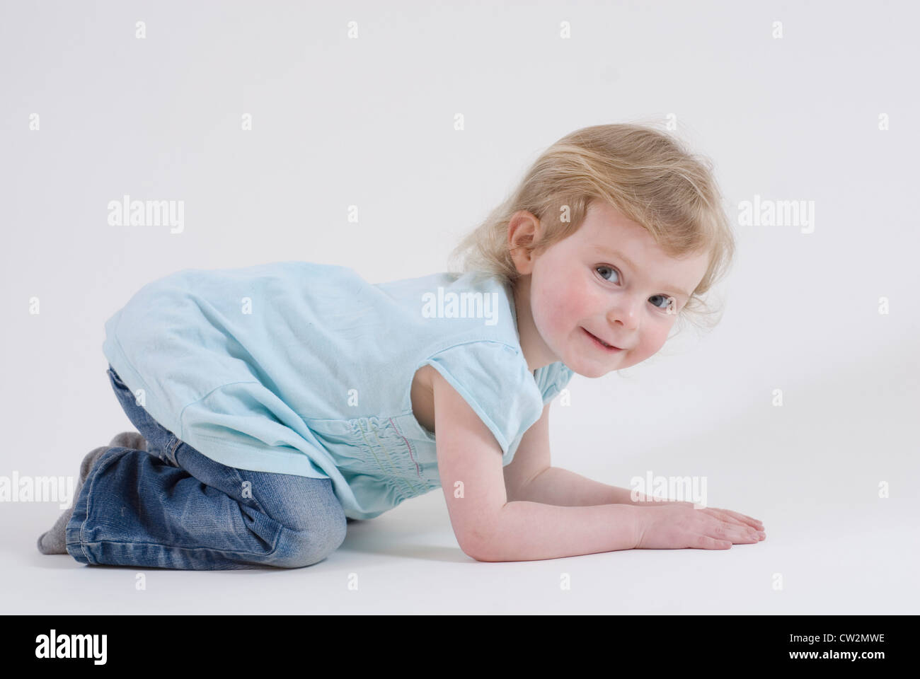 Cute Little Girl, Two Years Old, Posing Crouching on all Fours Playing ...