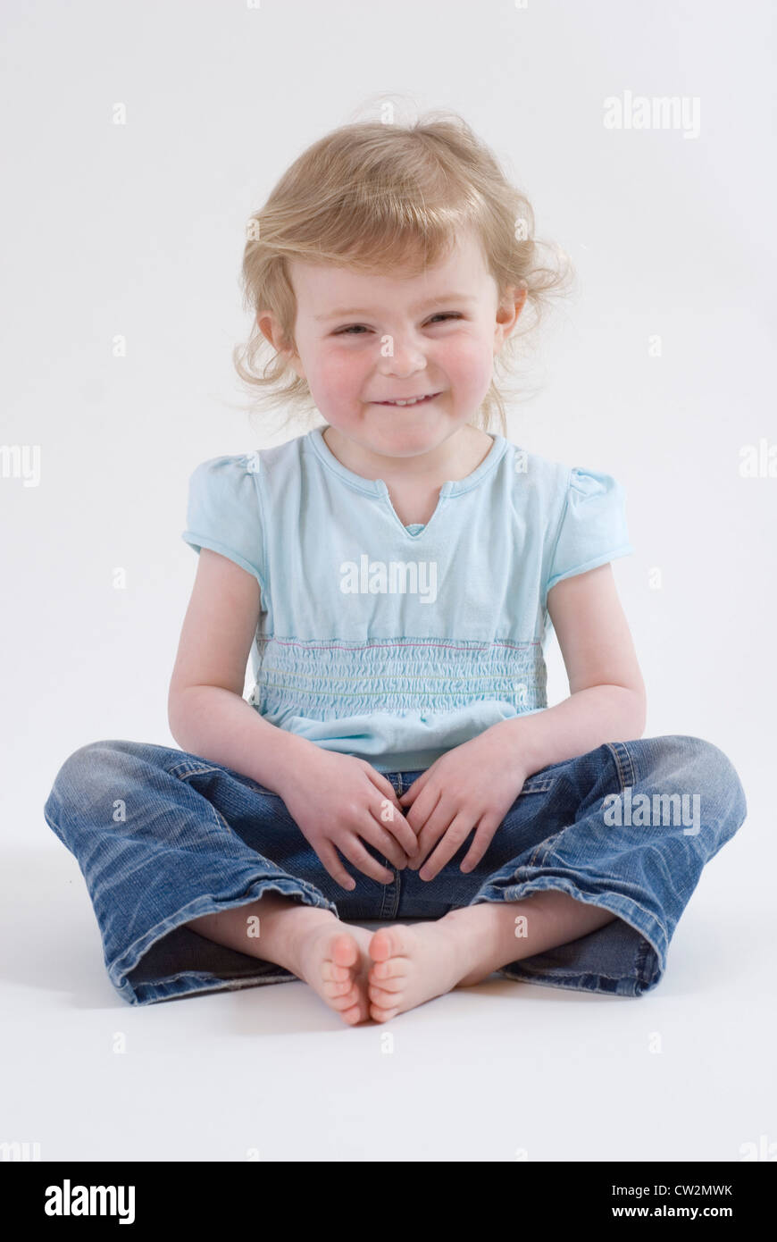 Cute Little Girl, Two Years Old, Sitting Cross Legged Looking & Smiling ...