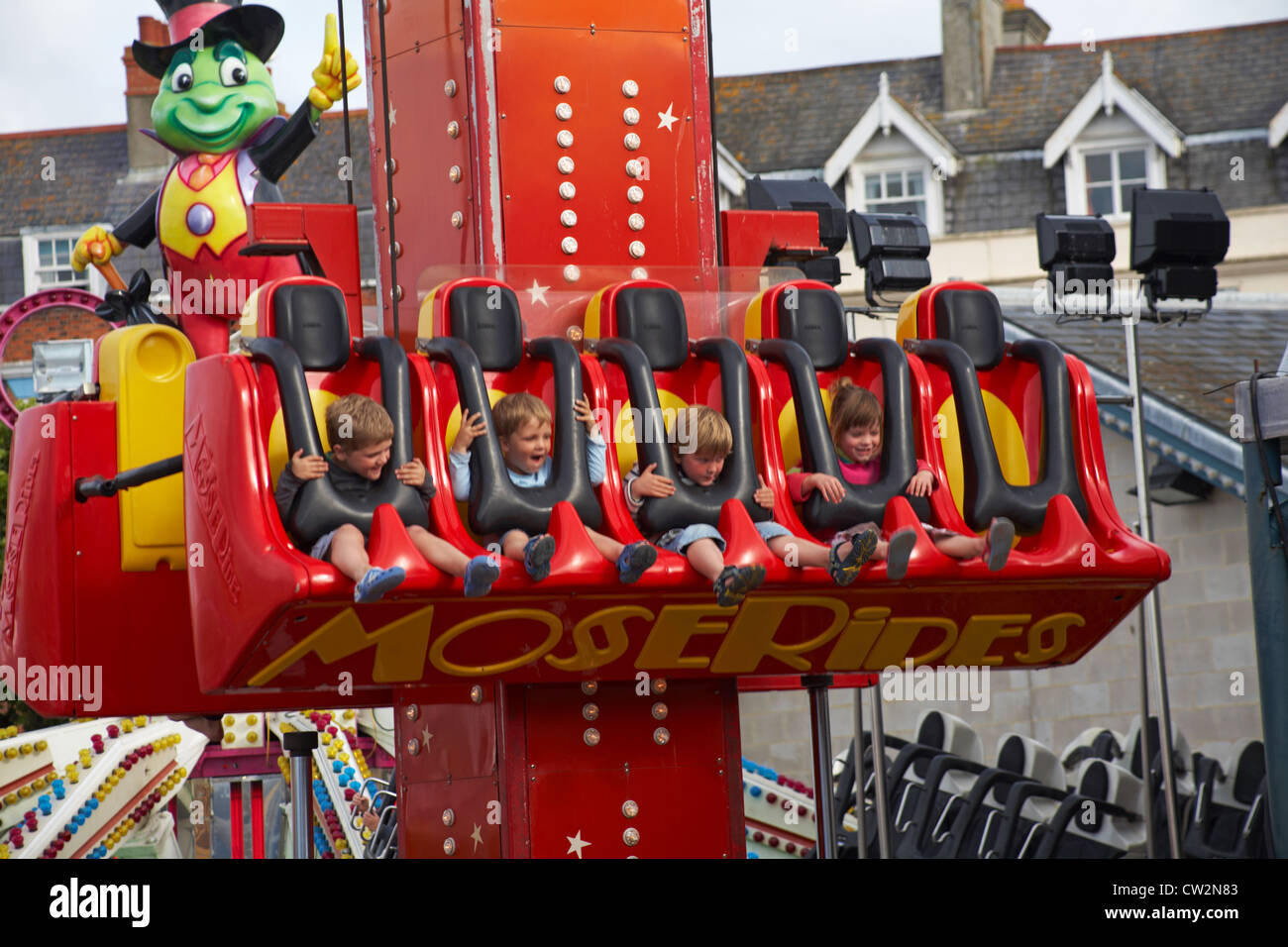 Four young children on fairground ride MosesRides at Weymouth in August ...
