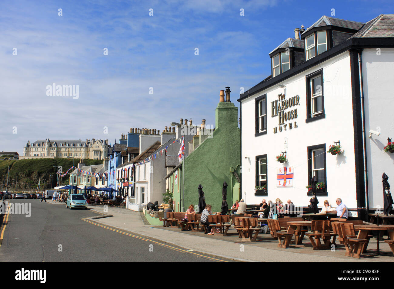 View along harbourside street in Portpatrick village, Dumfries and ...