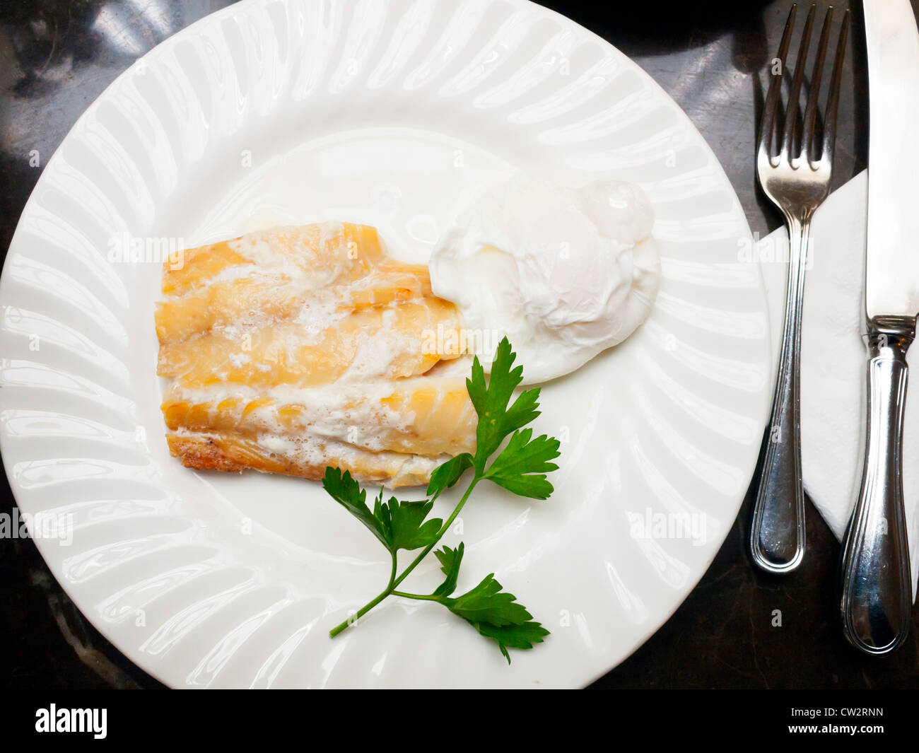 A light lunch of haddock and poached egg Stock Photo - Alamy