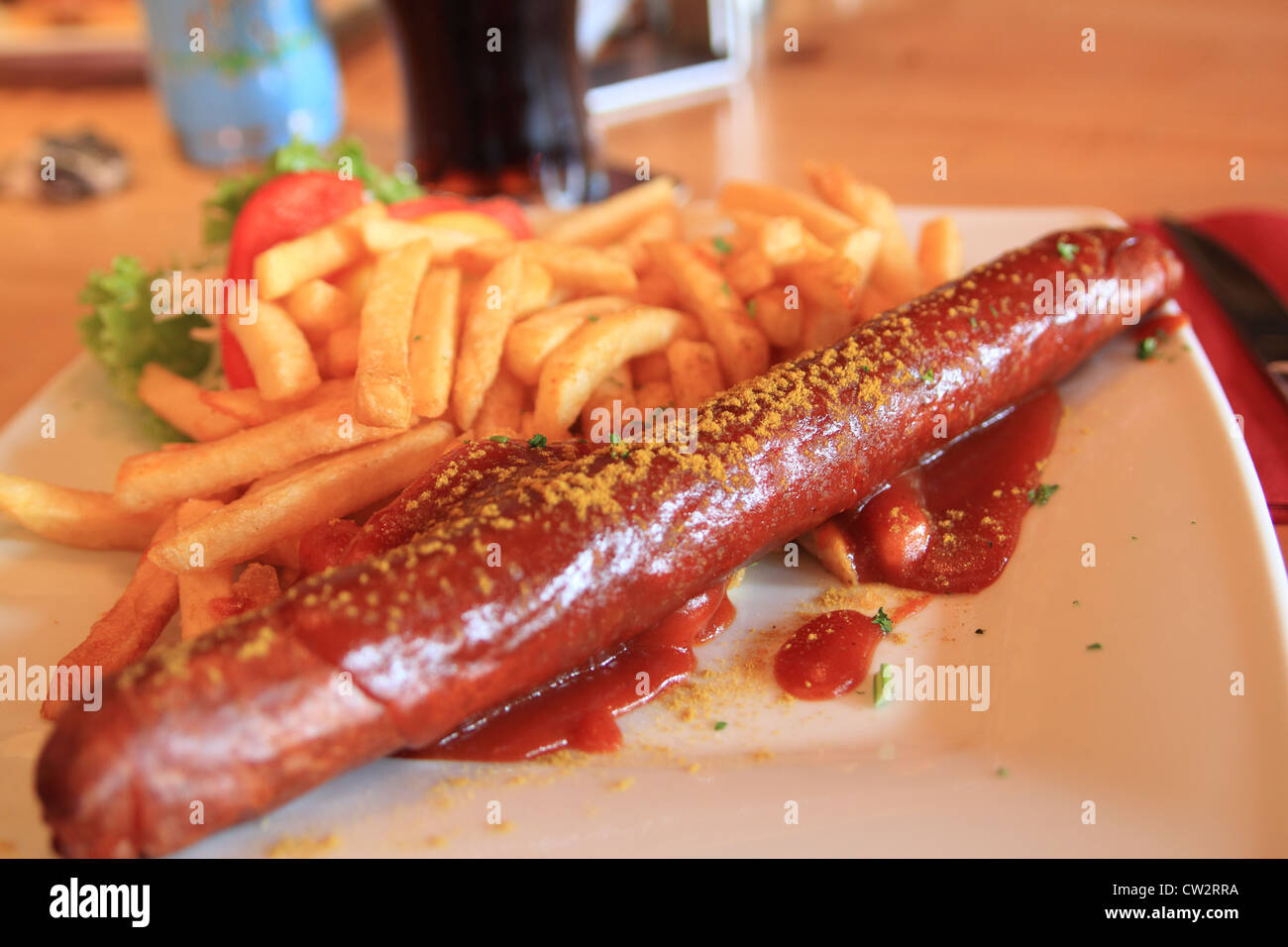 Currywurst is a german fast food, served with french fries Stock Photo ...
