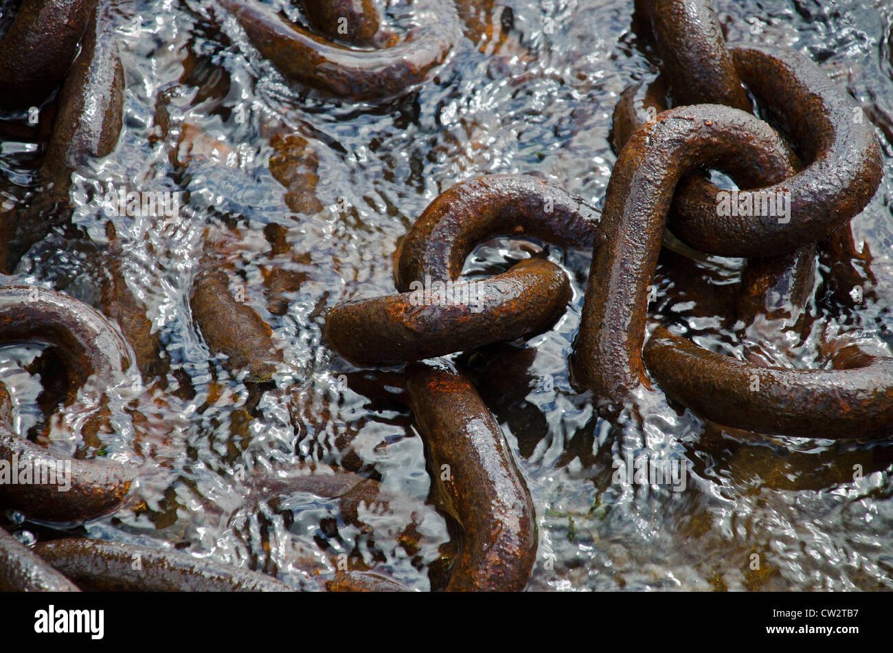 rusty chain in water Stock Photo - Alamy