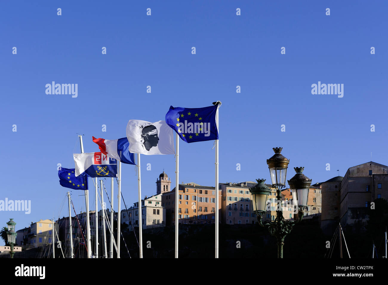 Flags at old harbor and citadel in Bastia, Corsica, France Stock Photo ...
