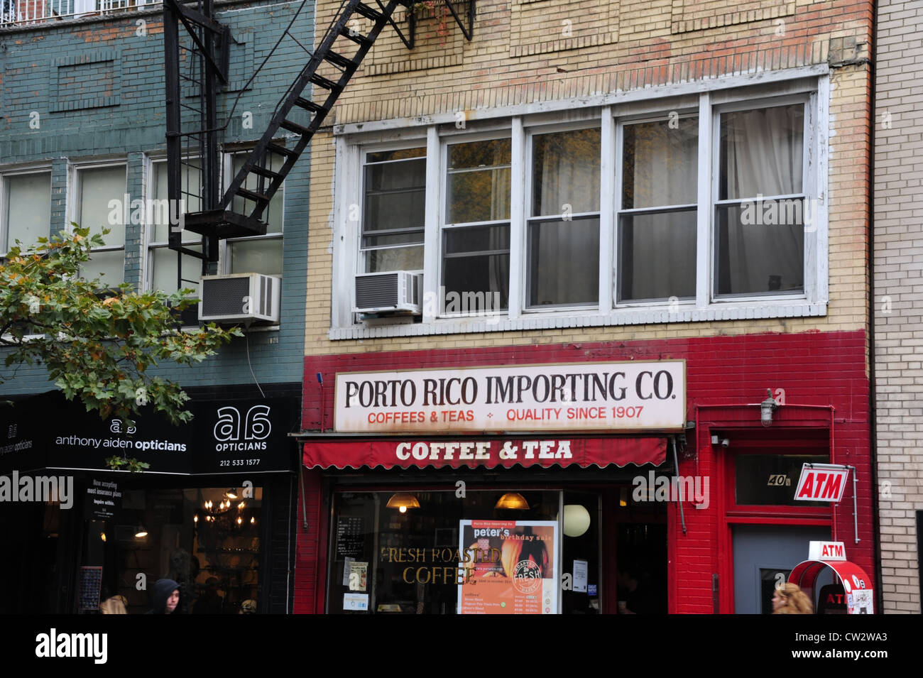 Sidewalk view red painted facade electric lights window Porto Rico ...