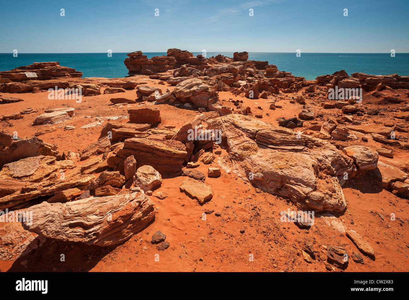 The Red Cliffs in Stark Contrast with the Deep Blue Sky and Ocean at ...