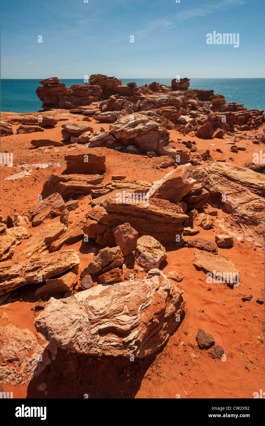 The Red Cliffs in Stark Contrast with the Deep Blue Sky and Ocean at ...