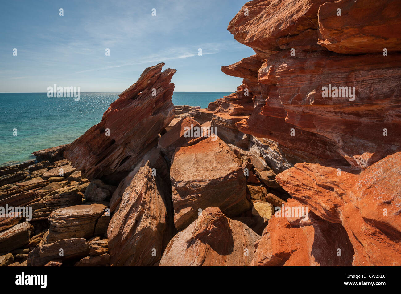 The Red Cliffs in Stark Contrast with the Deep Blue Sky and Ocean at ...