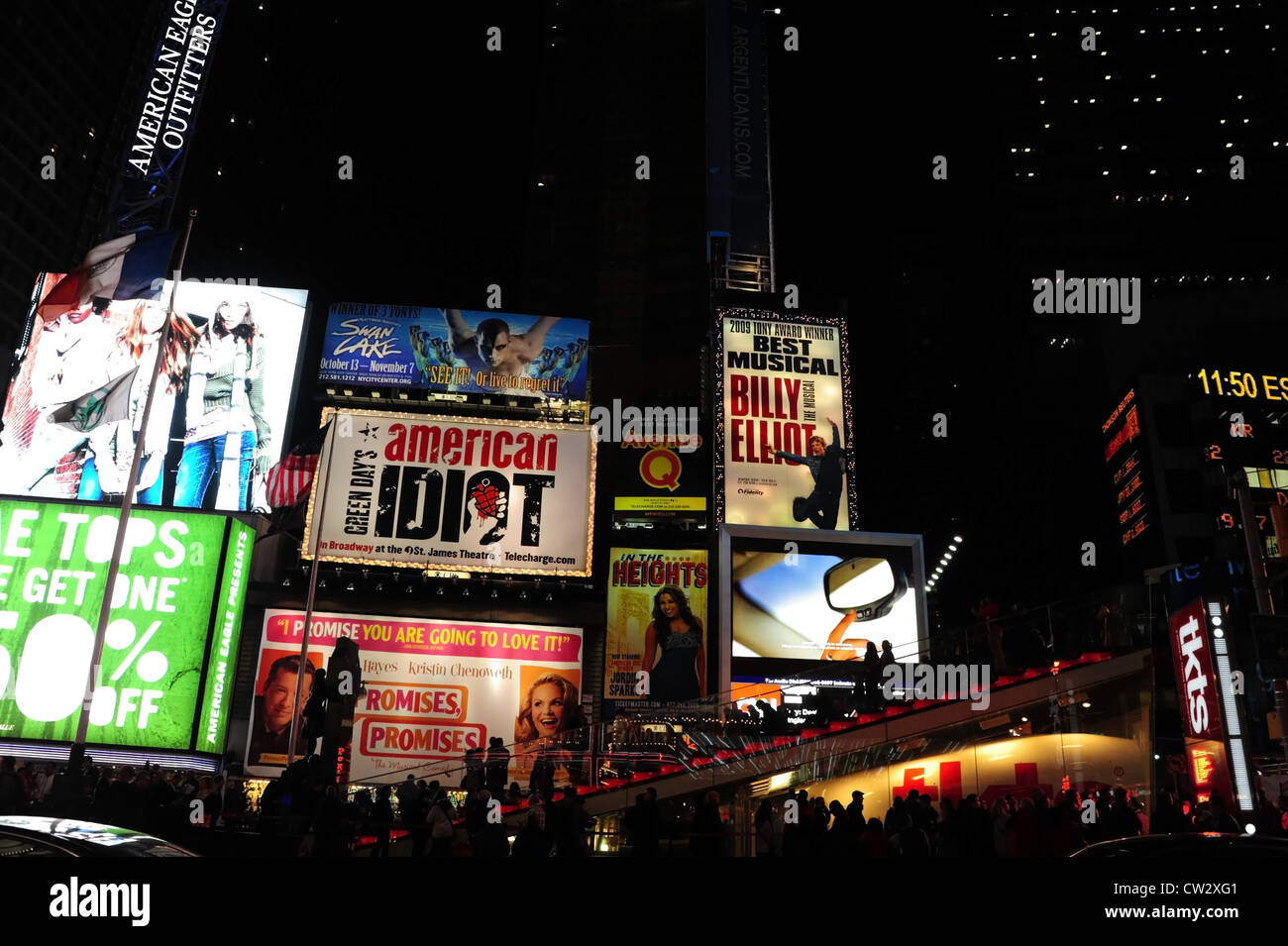 Sign 1 illuminated red white tkts standing rising right mid distance hi ...