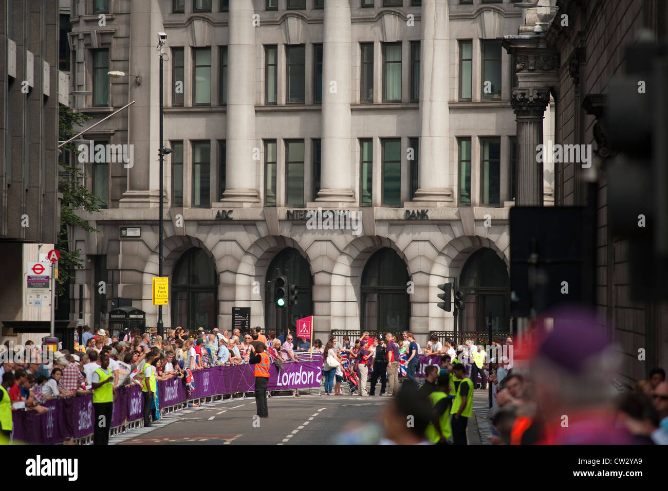 Crowds of spectators line the streets of the City of London on the ...
