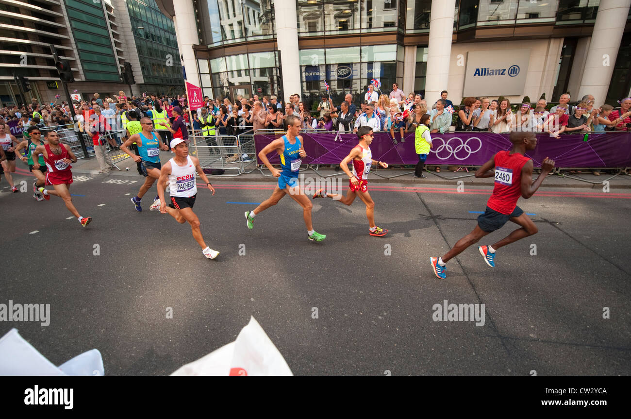 Crowds of spectators line the streets of the City of London on the ...