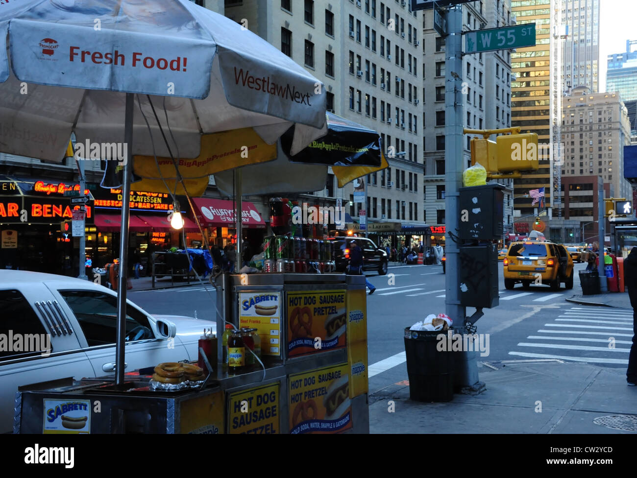 Urban street view, to red neon Benash Bar, fast-food stall selling hot ...