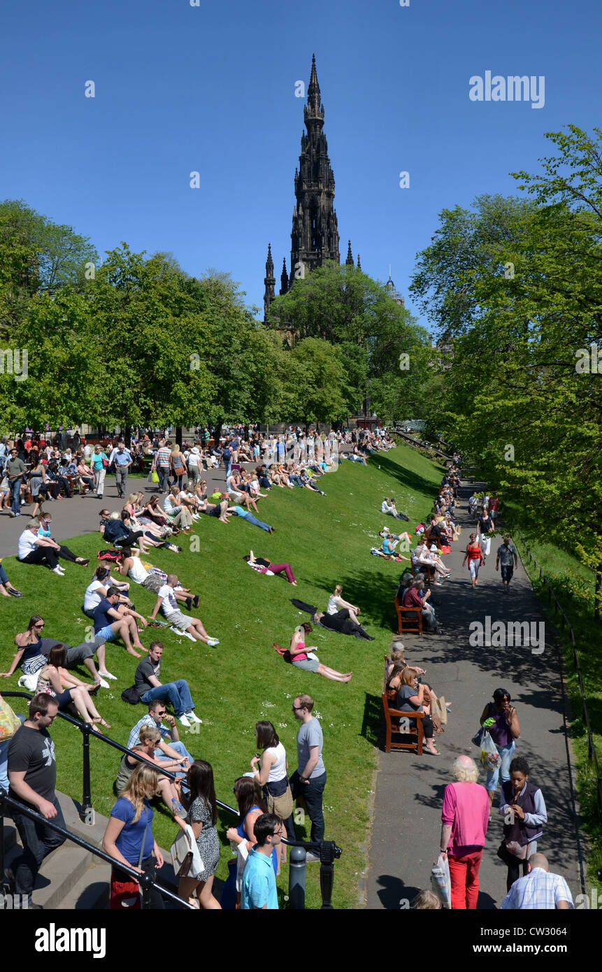 Locals and tourists alike enjoy the sun in Edinburgh's Princes Street ...